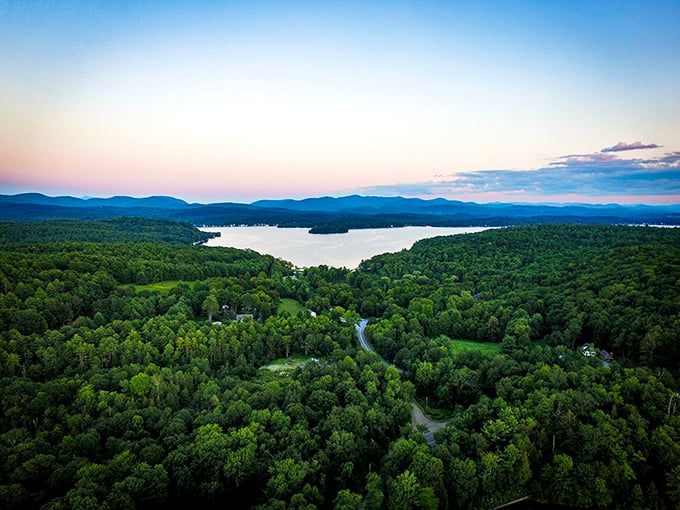 A bird's-eye view of paradise where forest meets water. Lake Bomoseen stretches like a mirror between Vermont's rolling hills, nature's ultimate stress reliever.