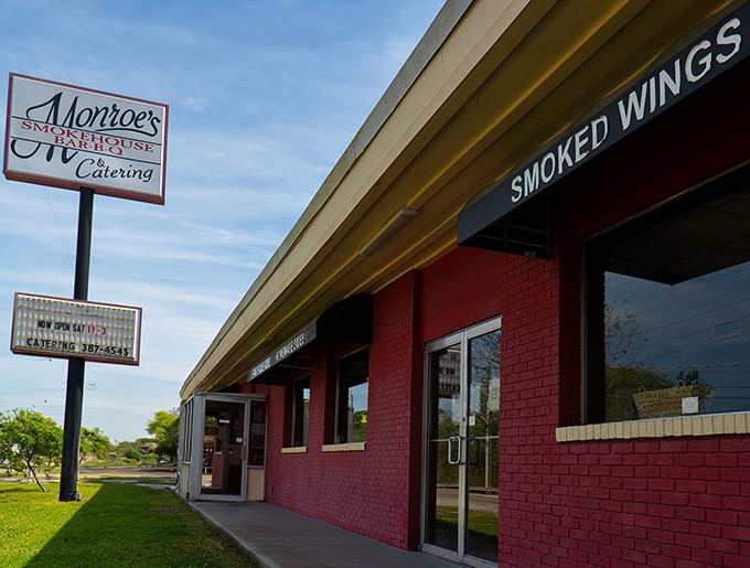 The brick-red exterior of Monroe's stands like a beacon of barbecue hope in Jacksonville. No fancy frills needed when what's inside smells this good.
