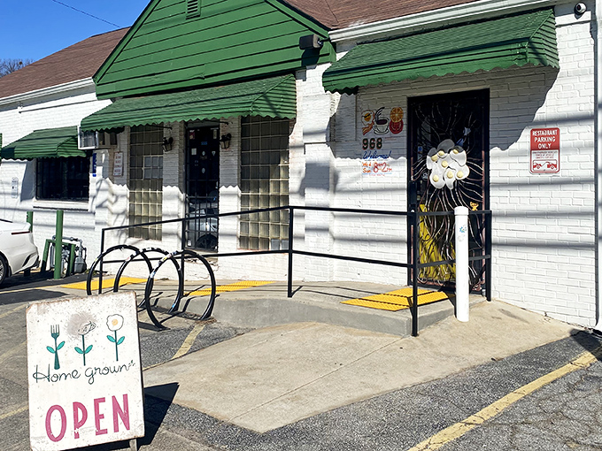 That distinctive green awning beckons like a lighthouse for hungry souls seeking breakfast salvation on Memorial Drive.