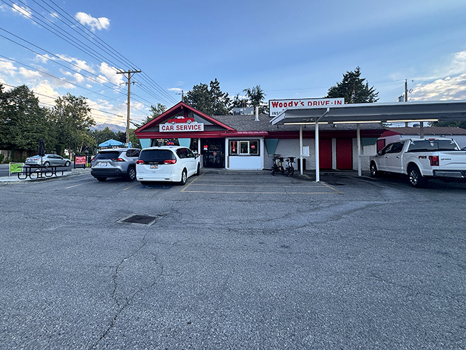 The classic red exterior of Woody's Drive-In stands as a beacon of burger bliss in Murray, where time seems to have stood deliciously still.