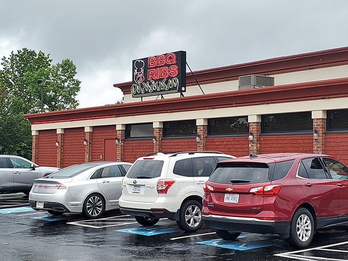 The neon palm tree and bold red lettering of Dee Jay's entrance tower isn't just a sign&mdash;it's a beacon calling to BBQ pilgrims from miles around.