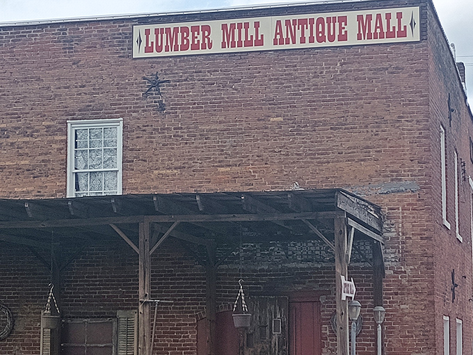 The iconic red lettering against weathered brick announces your arrival at treasure-hunting paradise. Like a siren song for vintage enthusiasts everywhere.