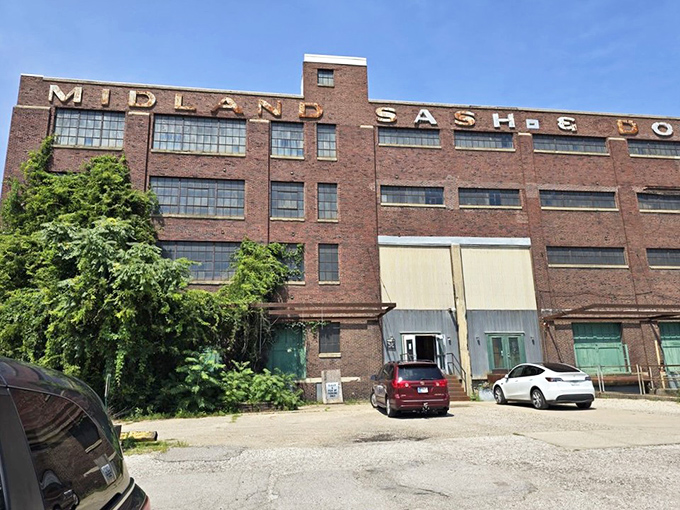 The imposing brick facade of Midland Arts & Antiques Market stands like a time machine disguised as architecture, promising treasures within its historic walls.