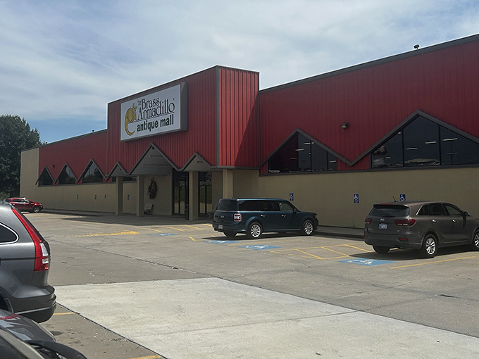 The distinctive red exterior of Brass Armadillo stands like a beacon for treasure hunters, promising adventures in nostalgia just beyond those doors.