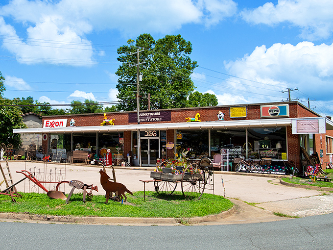 The brick facade of Junktiques beckons like a time portal disguised as a country store. Vintage signs and whimsical lawn art hint at treasures within.