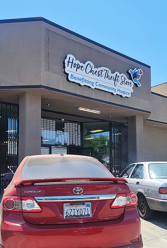 The unassuming exterior of Hope Chest Thrift Store, where bargain hunters' dreams come true and thirty-five bucks stretches like taffy on a summer day.