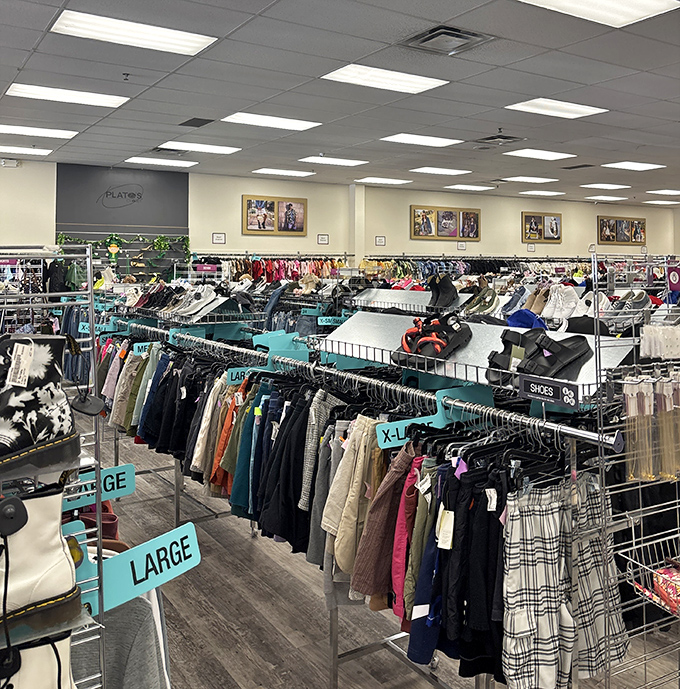 Inside, a meticulously organized wonderland of second chances awaits &ndash; where clothing racks create a labyrinth of possibility and those turquoise size markers serve as your treasure map.