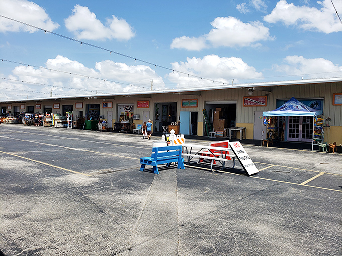 The treasure hunt begins! B&A Flea Market's unassuming exterior hides a wonderland of bargains waiting to be discovered under the brilliant Florida sky.