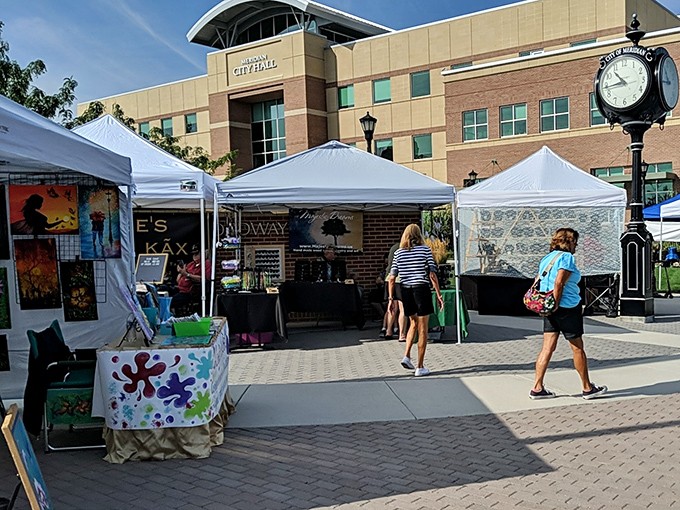 White tents line the plaza outside Meridian City Hall, where treasure hunters begin their weekend quests for unique finds.