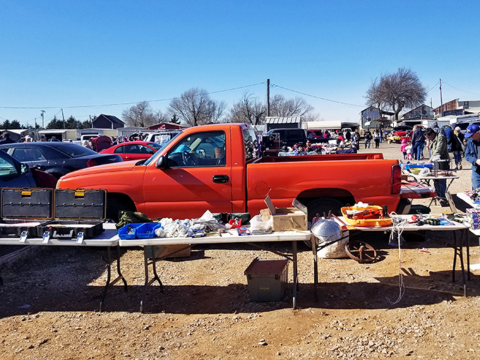 The treasure hunt begins! Pickup trucks and folding tables create the perfect backdrop for Oklahoma's ultimate weekend adventure.