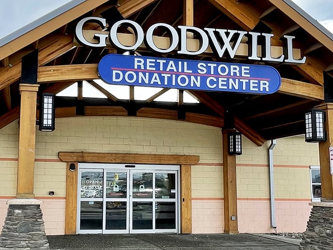 The rustic wooden beams and iconic blue signage welcome bargain hunters like a lighthouse guiding ships to treasure-filled shores.