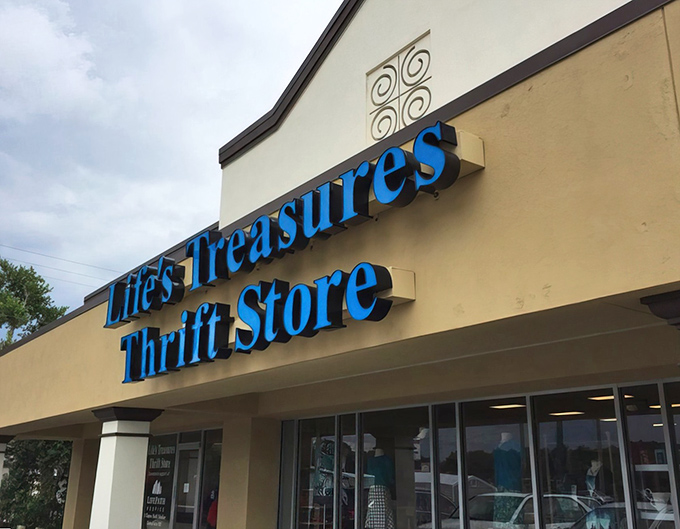The bright blue signage of Life's Treasures beckons bargain hunters like a retail oasis in the Florida sun. Shopping salvation awaits inside!