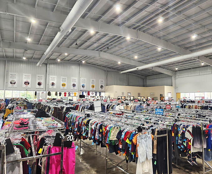 Welcome to treasure hunter paradise! The Durham Rescue Mission Thrift Store's expansive clothing section stretches as far as the eye can see under industrial-chic exposed ceilings.