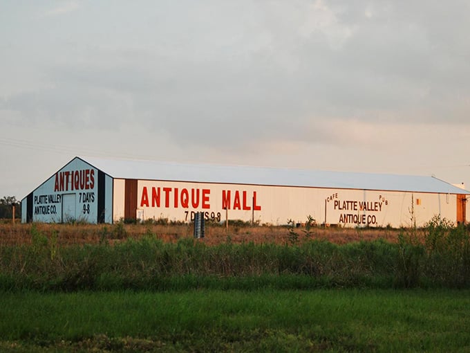 
The unassuming exterior of Platte Valley Antique Mall stands like a time capsule against the Nebraska sky, beckoning travelers to explore its treasures. 