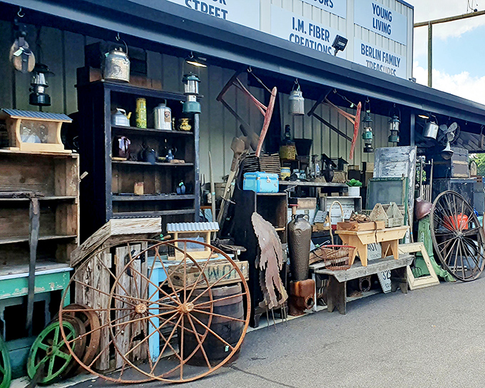The front porch of nostalgia! Rusty wagon wheels and weathered farm implements create an irresistible invitation to step back in time.