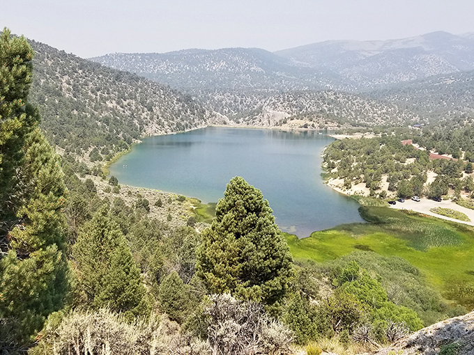 Nature's perfect mirror: Cave Lake's crystal waters reflect the surrounding Schell Creek Range in a display that puts Instagram filters to shame.