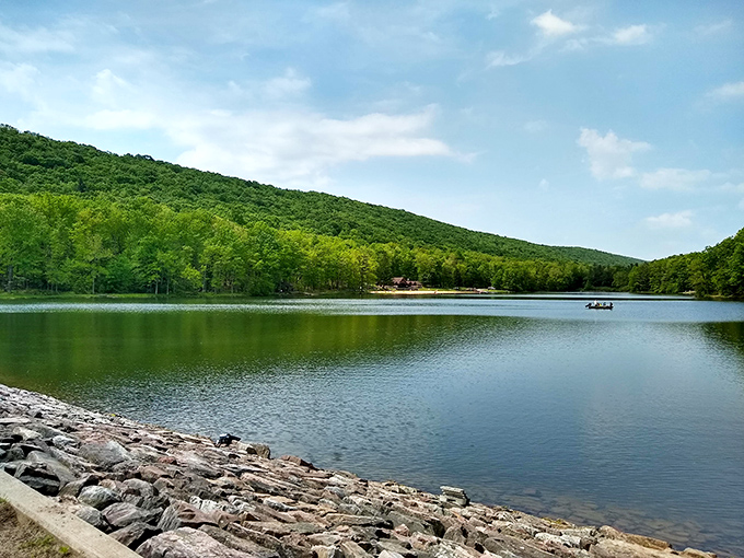 Poe Valley's lake mirrors the surrounding mountains like nature's own infinity pool, creating a postcard-perfect scene that no filter could improve upon.