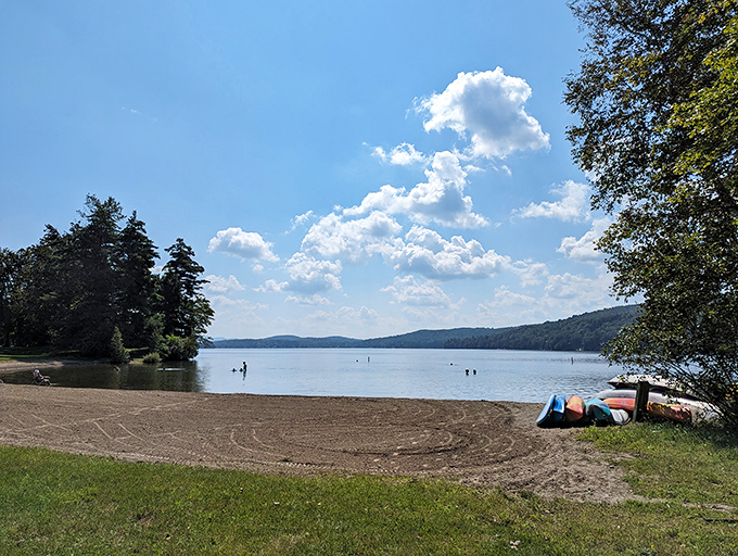 Dawn breaks over Lake St. Catherine with the gentleness of an old friend's greeting. The still waters mirror the surrounding hills, creating nature's perfect symmetry.
