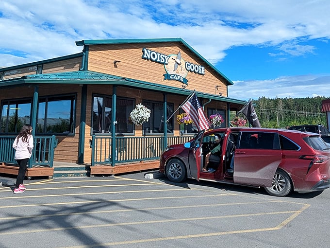American flags flutter proudly outside this rustic Palmer treasure, where the wooden porch practically begs you to come in and stay awhile.