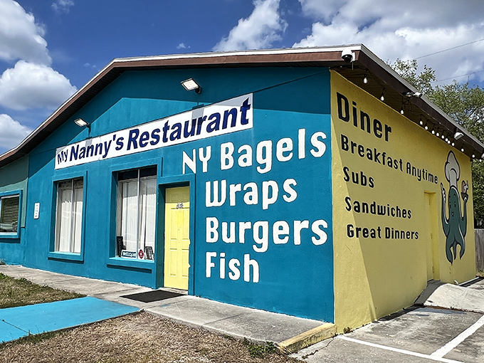 The bright blue and yellow exterior of My Nanny's Restaurant stands out like a culinary lighthouse, beckoning hungry travelers with promises of NY bagels and home-cooked comfort.