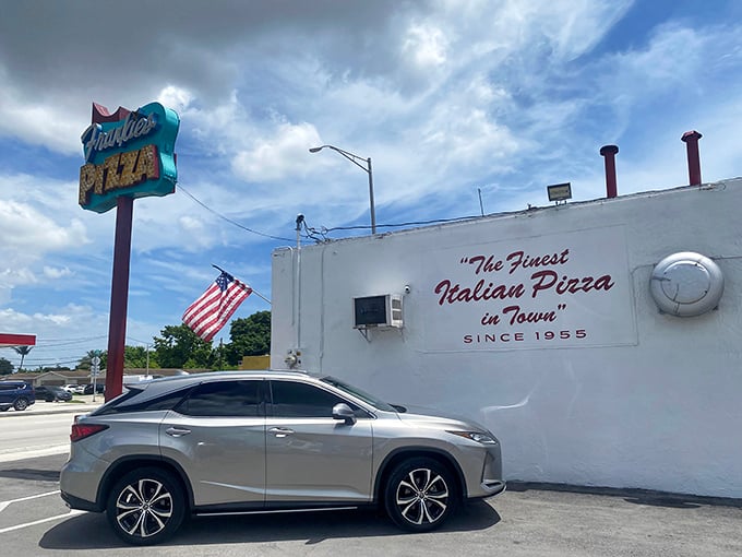 The side of the building proudly declares "Finest Italian Pizza in Town" since 1955&mdash;a bold claim that generations of loyal customers confirm is no exaggeration.
