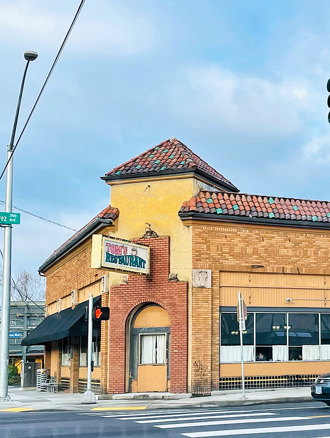 The Spanish-style roof tiles and vintage sign of Tom's Restaurant stand as a delicious rebellion against Portland's trendier breakfast spots.