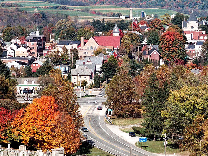 Historic storefronts line Ligonier's charming streets, where brick and stone buildings have witnessed centuries of small-town life unfolding beneath their covered walkways. 