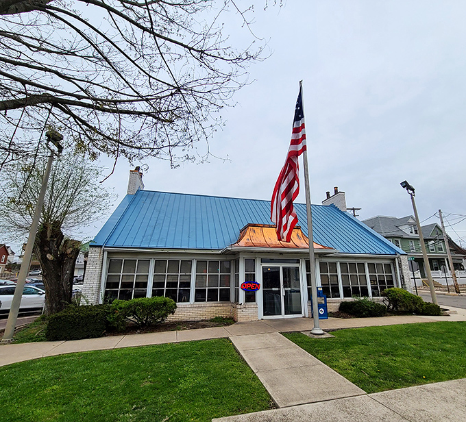 The iconic blue roof and American flag welcome hungry travelers like a beacon of breakfast hope on the Bloomsburg horizon.