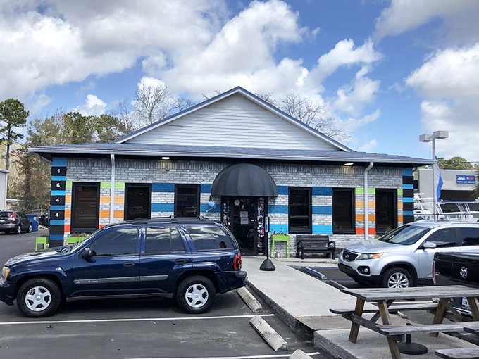The colorful exterior of Early Bird Diner stands out like a rebellious art project on Savannah Highway, promising flavors as bold as its blue-striped facade.