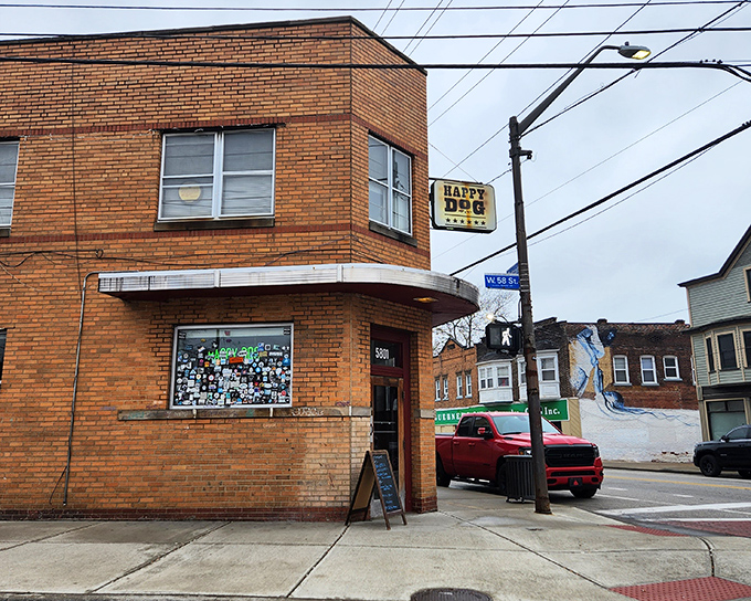 The unassuming brick exterior of Happy Dog stands like a culinary speakeasy in Cleveland's Gordon Square, its vintage sign promising simple pleasures done right.