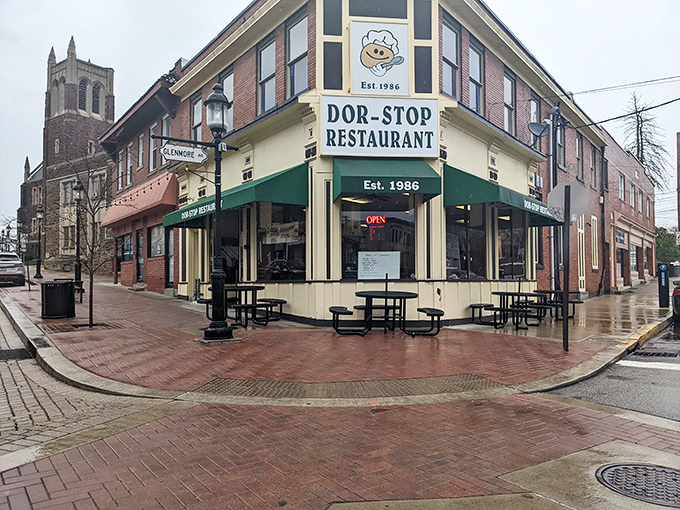 The iconic green awning of Dor-Stop Restaurant beckons hungry Pittsburghers like a breakfast lighthouse guiding morning-starved sailors to shore.
