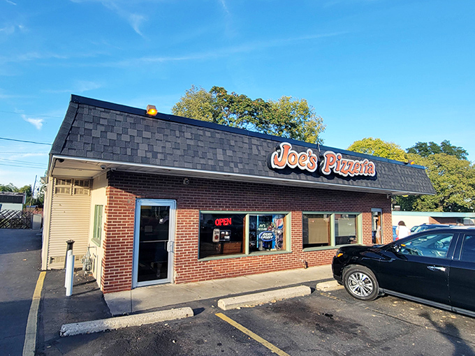 The unassuming brick exterior of Joe's Pizzeria stands like a time capsule of Americana, promising authentic flavors rather than Instagram-worthy architecture.