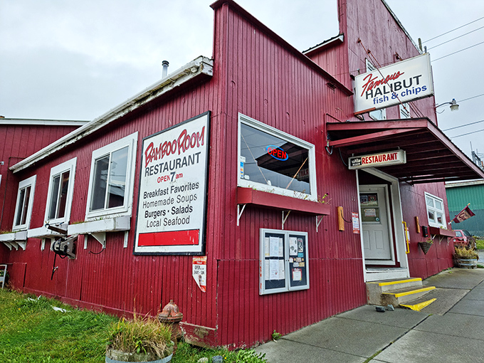 The crimson-colored Bamboo Room stands like a culinary lighthouse in Haines, its weathered exterior promising authentic Alaskan flavors within those humble walls.