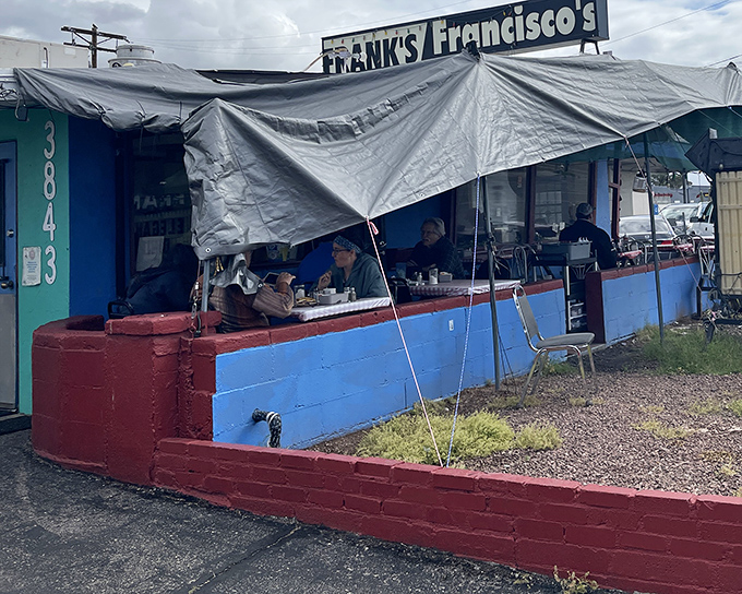 The blue exterior with its red brick base and practical tarp-covered patio isn't winning architectural awards, but it's winning the hearts of hungry Tucsonans daily.