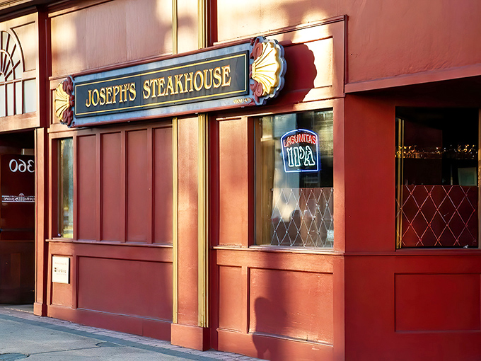 The iconic red facade of Joseph's Steakhouse stands like a beacon for carnivores on Bridgeport's Fairfield Avenue, promising meaty delights within.