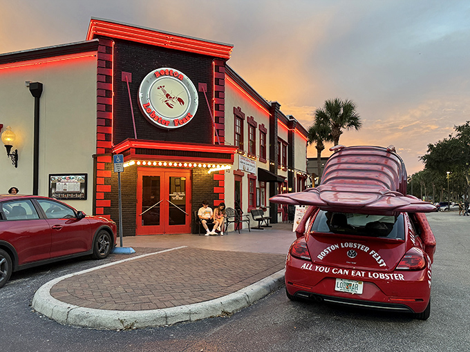 As the sun sets, Boston Lobster Feast's neon glow beckons seafood lovers&mdash;even their VW Beetle is dressed for dinner!
