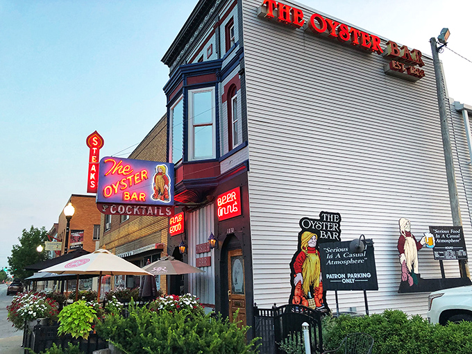 The iconic red neon sign beckons seafood lovers like a lighthouse for the landlocked. White clapboard and vintage charm set the perfect stage for oceanic delights.