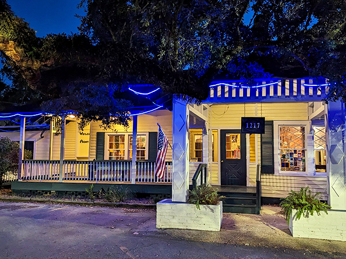 The blue-lit cottage at night isn't just a restaurant&mdash;it's a beacon of Southern comfort calling hungry travelers home.