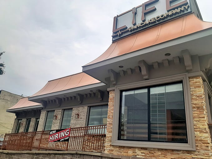 The copper-toned awnings and stone facade of Life Pancake Company stand out like a beacon for breakfast enthusiasts. Jersey City's hidden gem promises culinary salvation for the morning-starved.