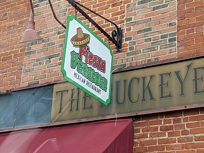 The unassuming sign hanging above "The Buckeye" promises authentic Mexican flavors hiding in plain sight on this Wilmington brick facade.