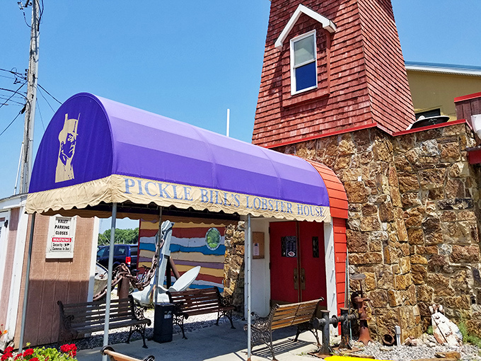 The lighthouse-inspired tower and stone facade of Pickle Bill's stands like a seafood beacon in landlocked Ohio, promising maritime delights under that unmistakable purple awning.