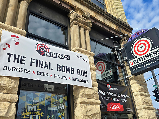 The Final Bomb Run awaits! AJ Bombers' stone facade and playful signage promise three essentials of happiness: burgers, beer, and flying peanuts.