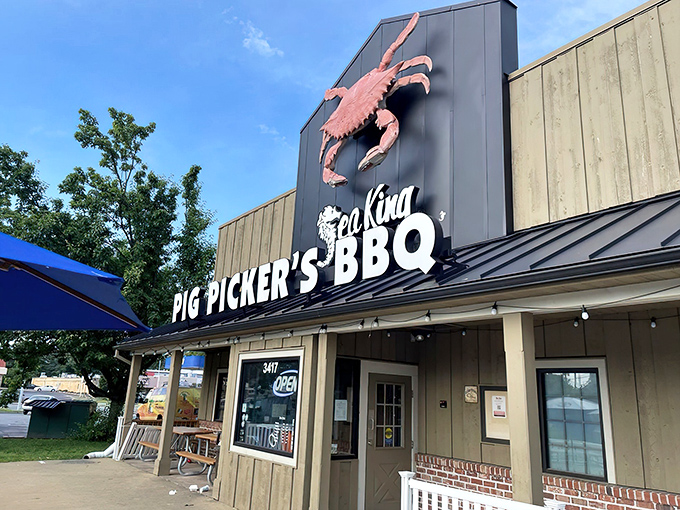 The giant red crab atop Sea King beckons like a crustacean lighthouse, promising treasures of the deep alongside smoky BBQ delights.