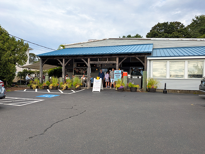 The blue-roofed beacon of seafood salvation sits unassumingly on Aquidneck Avenue, promising treasures from the deep without maritime pretension.
