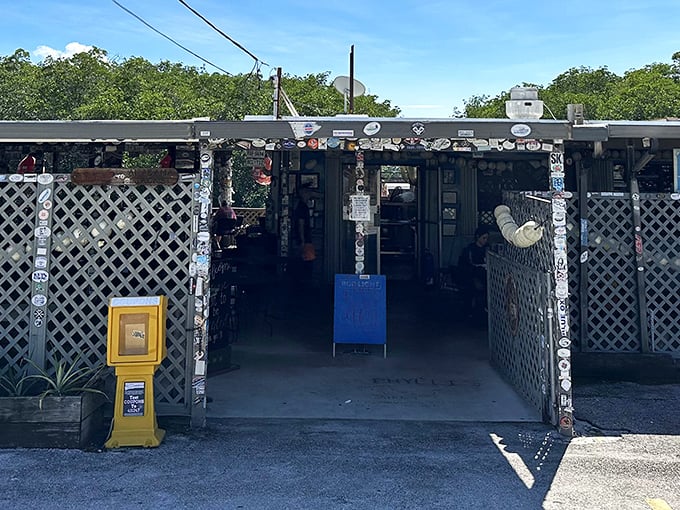 The entrance to Alabama Jack's looks like a portal to Old Florida &ndash; weathered wood, license plates, and a promise of authentic seafood adventures ahead.