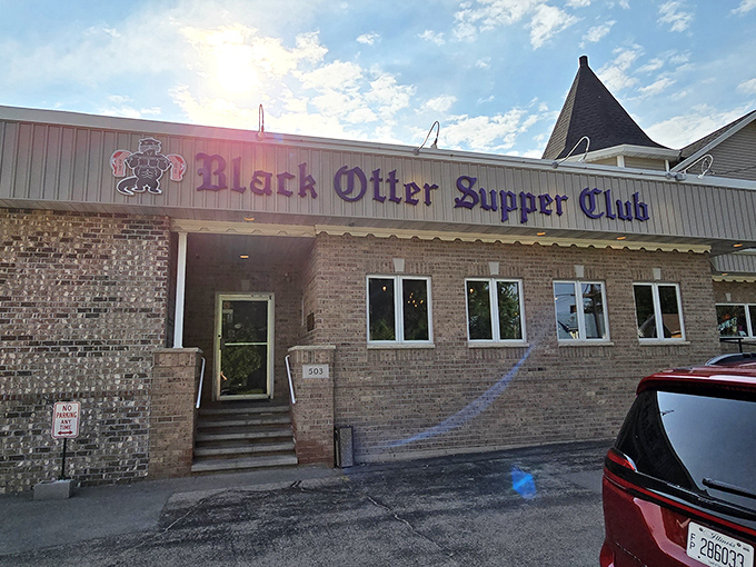 The purple lettering against brick isn't just signage&mdash;it's a beacon for hungry Wisconsinites who know that behind those doors, steak nirvana awaits.