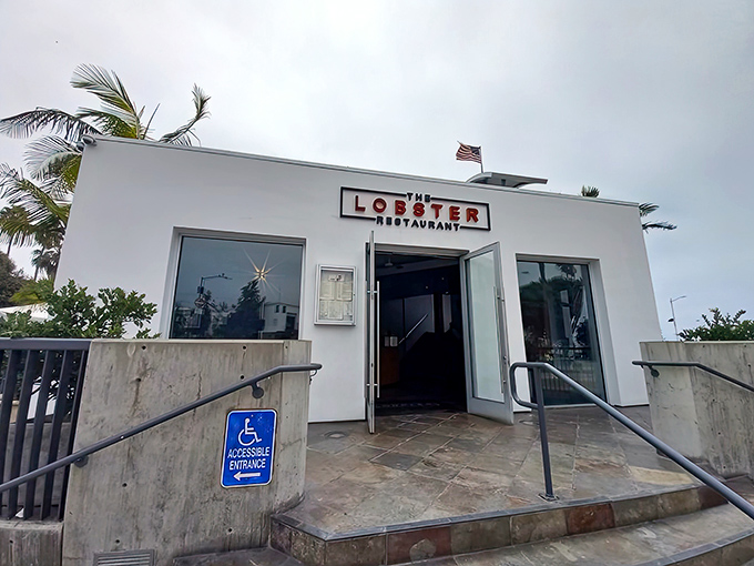 The unassuming white exterior of The Lobster belies the seafood magic happening inside. Like finding a pearl in an oyster, this entrance promises treasures within.