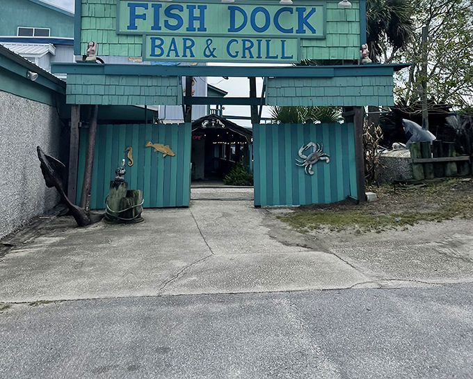The turquoise beacon of seafood salvation! The Fish Dock's weathered exterior and nautical decor promise authentic coastal dining without pretension.