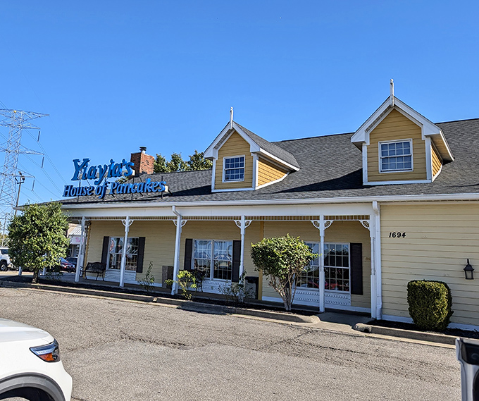 The cheerful yellow exterior of Yiayia's stands like a sunrise on the horizon, promising pancake perfection and that life-changing French toast waiting just beyond those welcoming doors.