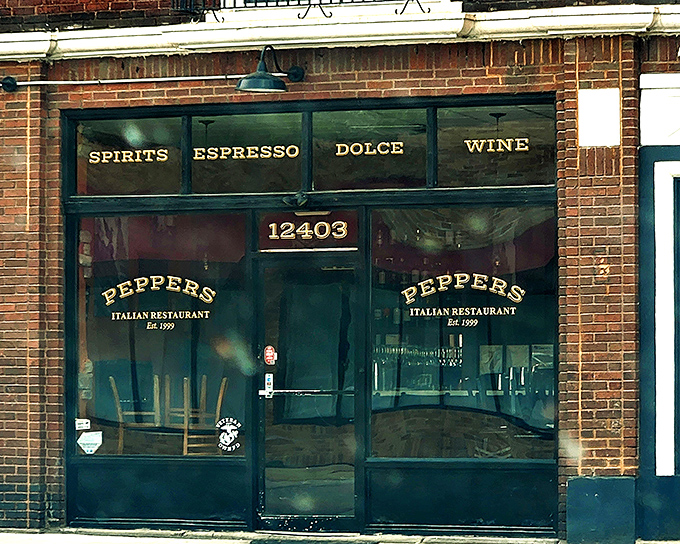 The unassuming green storefront of Pepper's beckons with neon pizza signs and a "Welcome" that feels like your Italian grandmother's embrace.